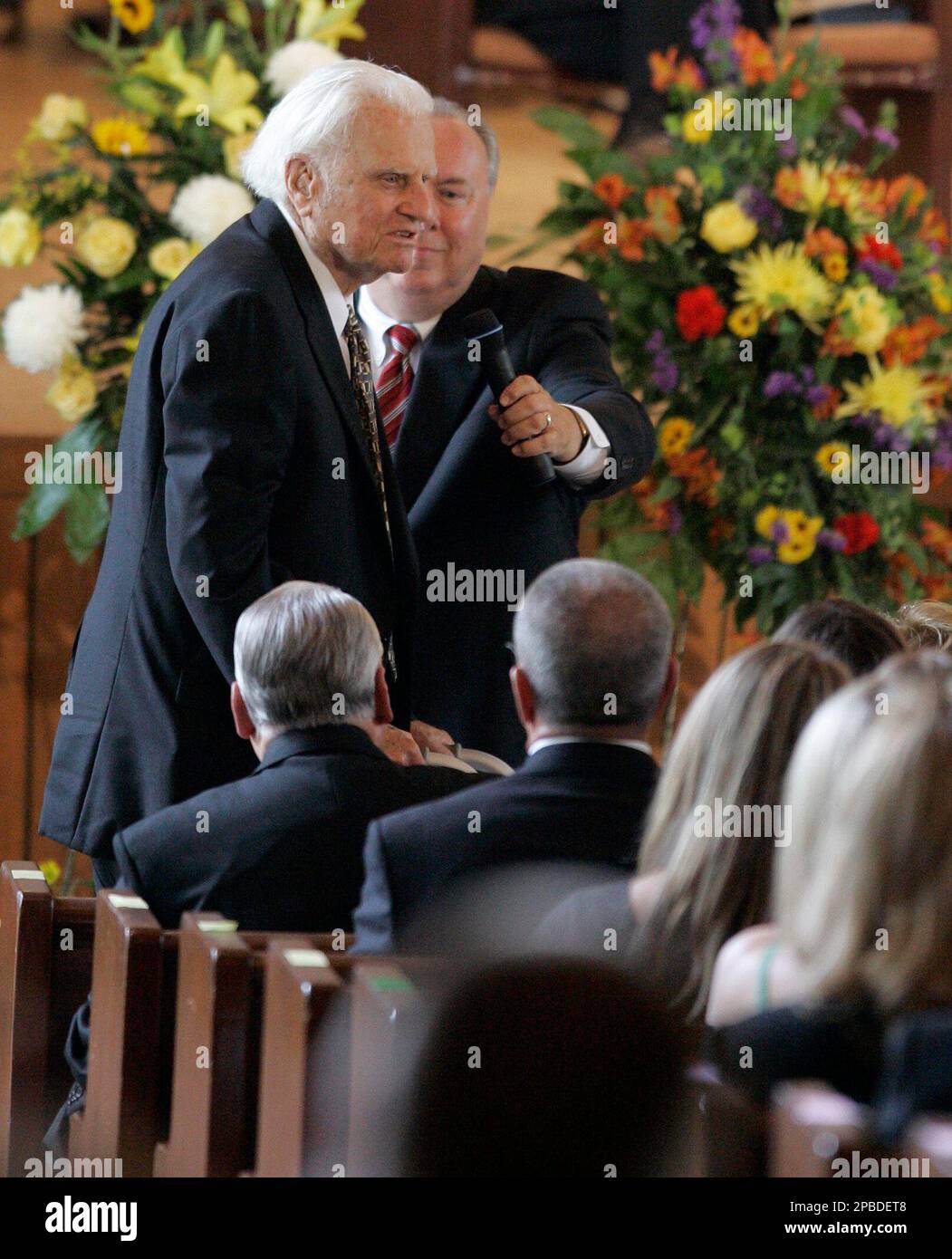 Billy Graham, left, speaks during a memorial service for his wife, Ruth ...