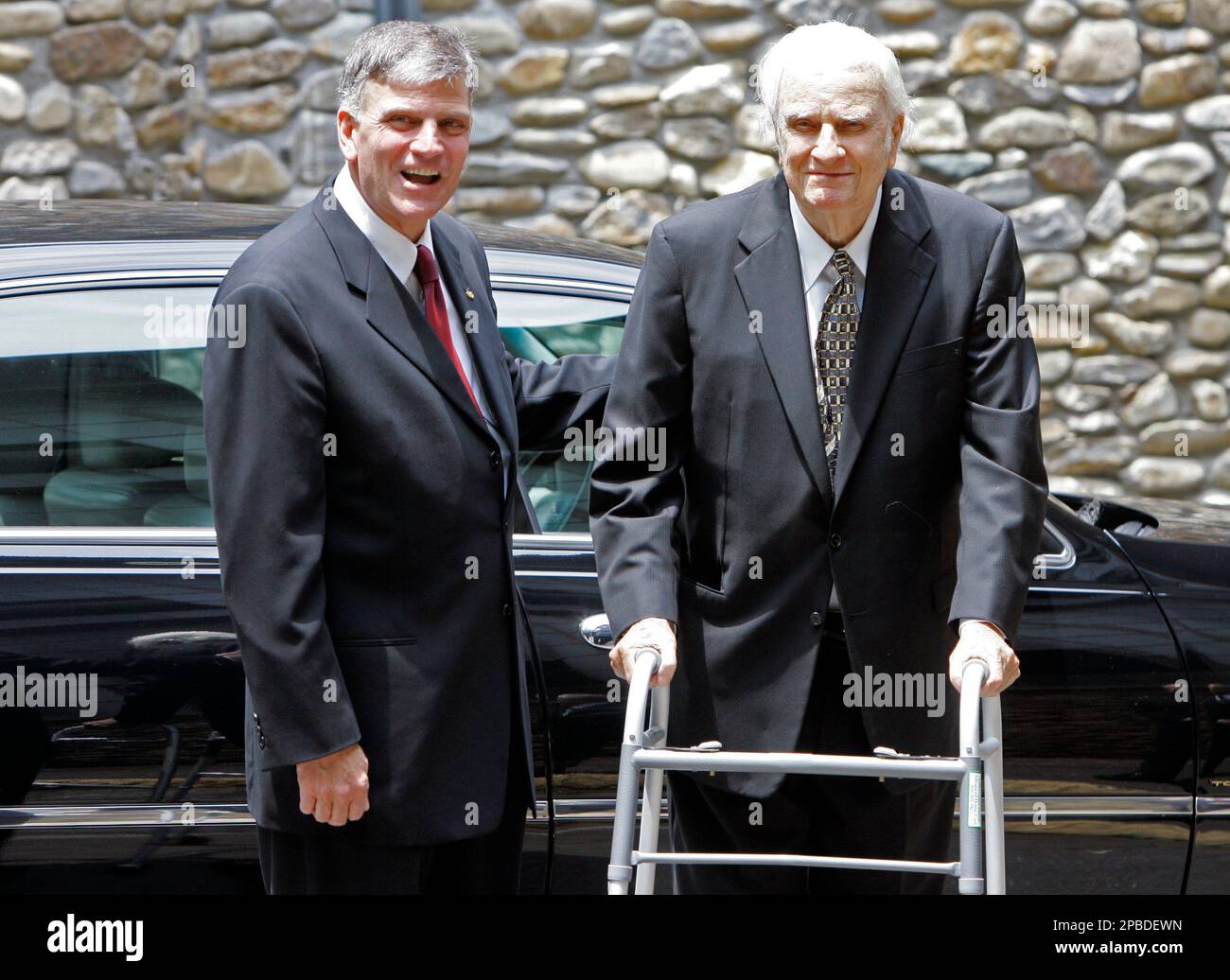 Billy Graham, right, arrives with his son, Franklin Graham, left, for a ...