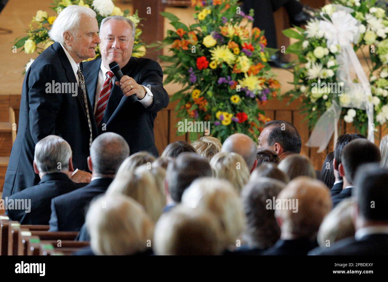 Billy Graham, left, speaks during a memorial service for his wife, Ruth ...