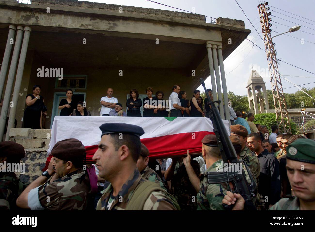 The coffin of Lebanese Army soldier Elias Hana Ahmar, 21, is carried by his comrades during his ...