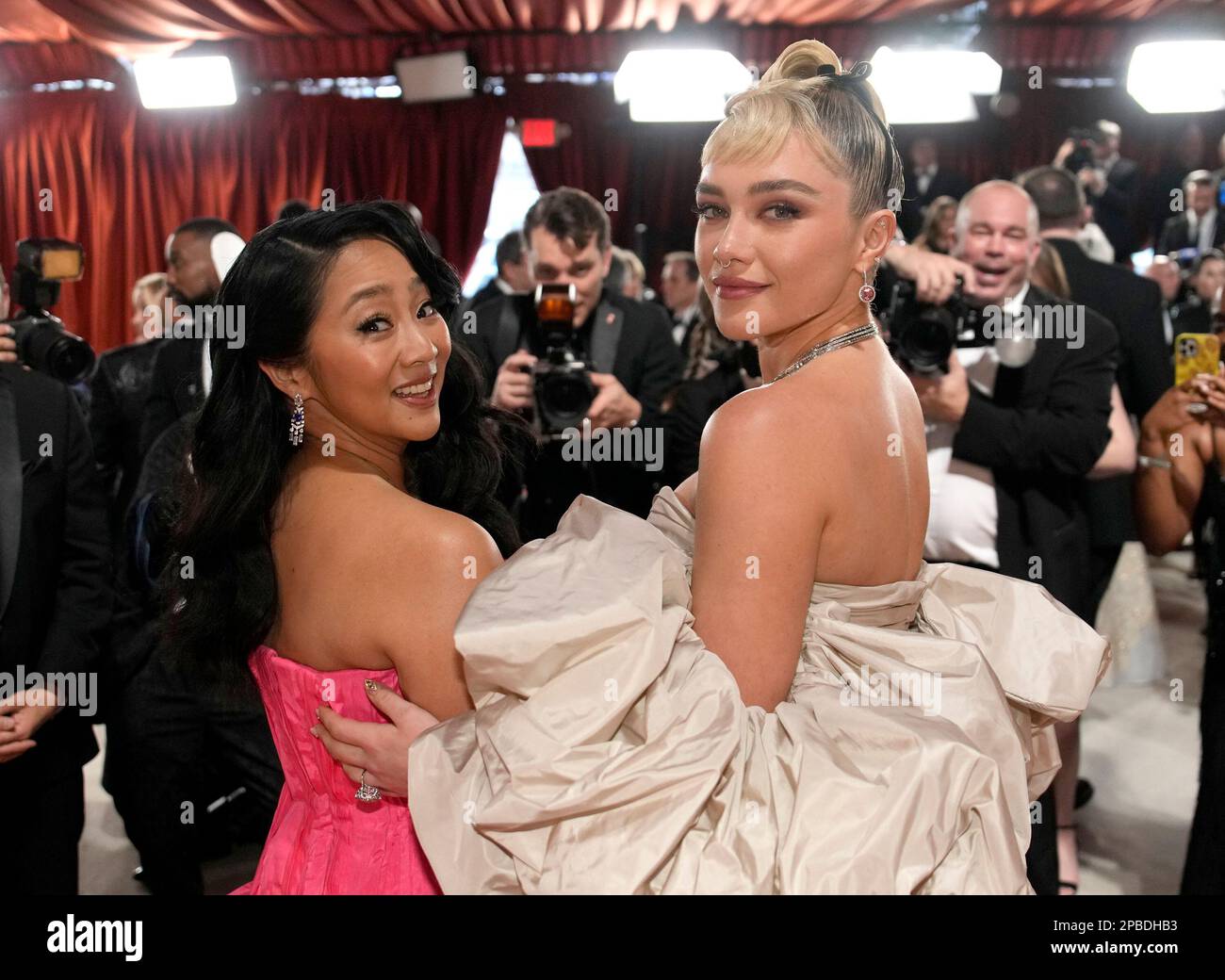 Stephanie Hsu, left, and Florence Pugh arrive at the Oscars on Sunday ...