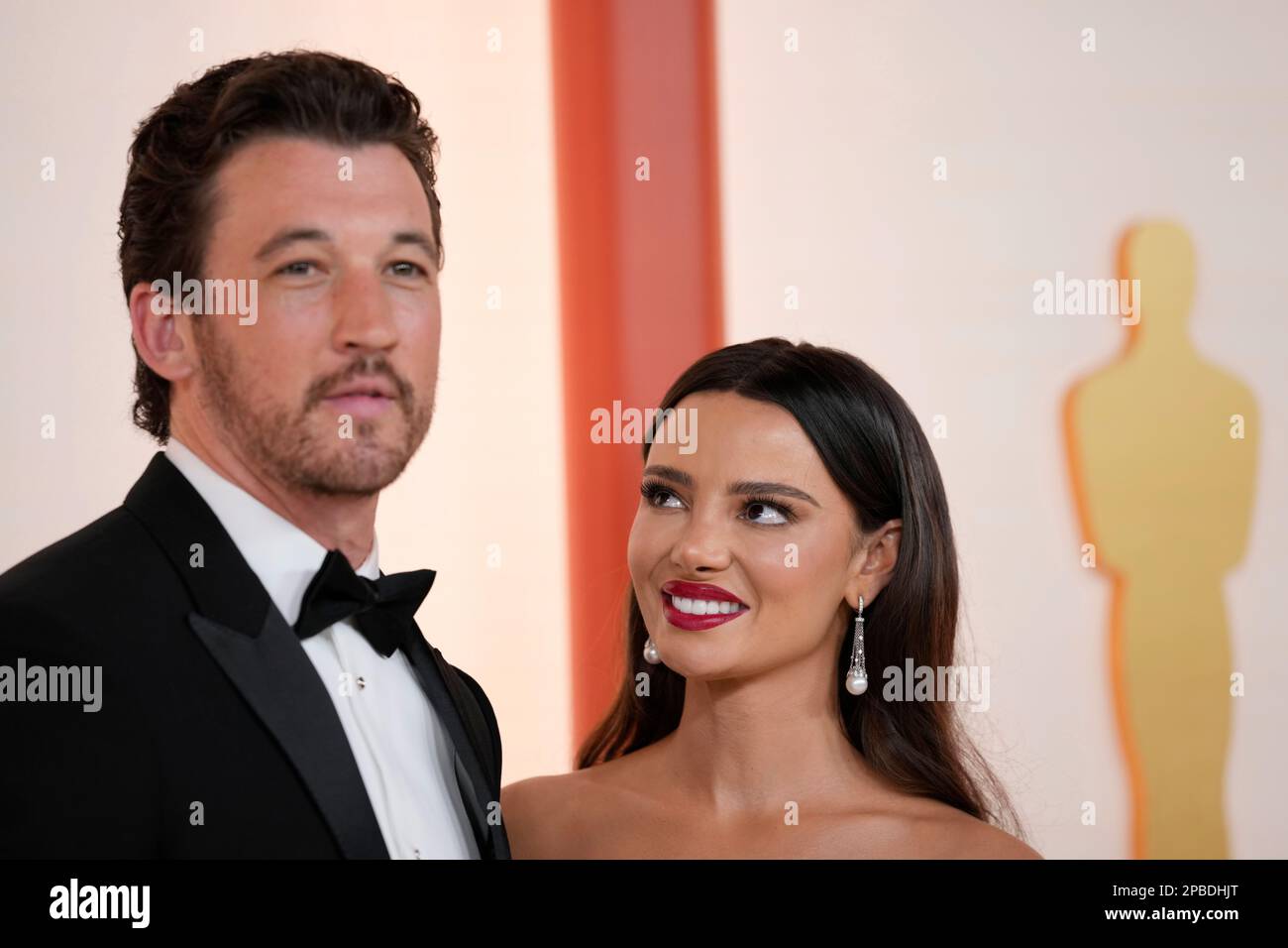 Miles Teller, left, and Keleigh Sperry arrive at the Oscars on Sunday ...