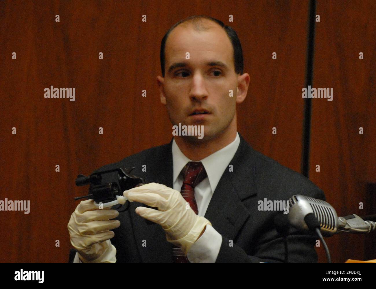Prosecution witness James Carroll, a criminologist for the Los Angeles ...