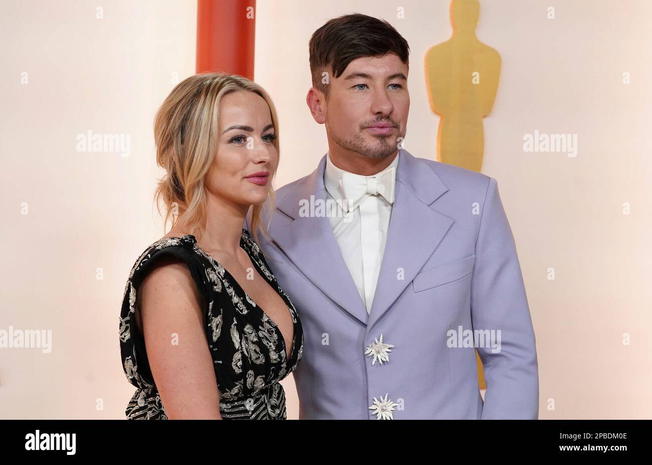 Alyson Sandro, left, and Barry Keoghan arrive at the Oscars on Sunday ...