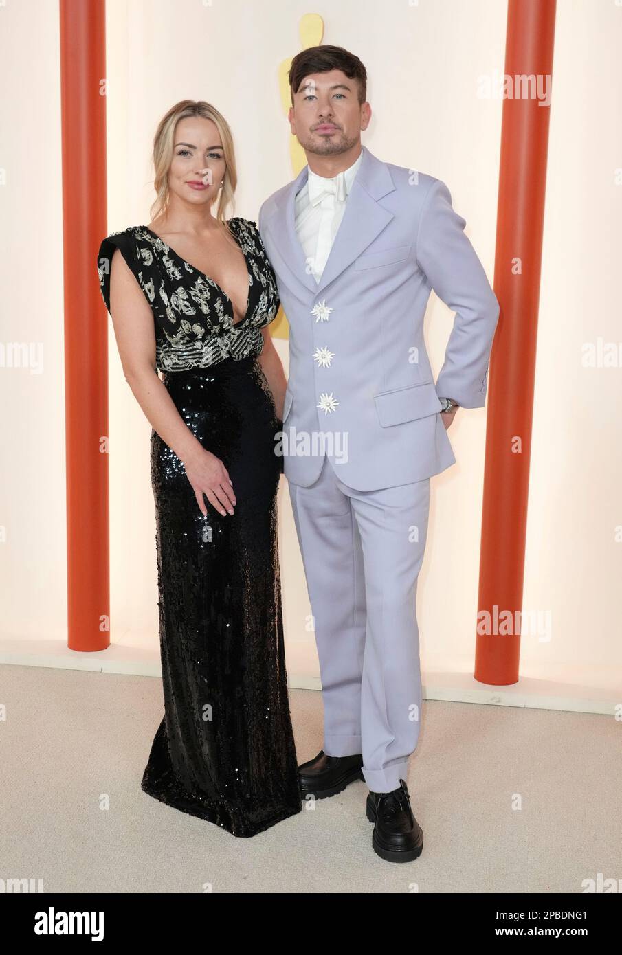 Alyson Sandro, left, and Barry Keoghan arrive at the Oscars on Sunday ...