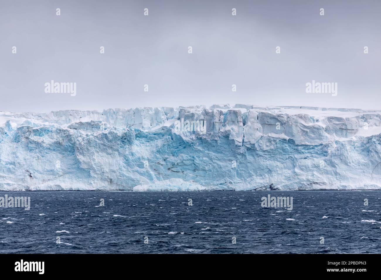 A massive iceberg floating in Antarctica Stock Photo - Alamy