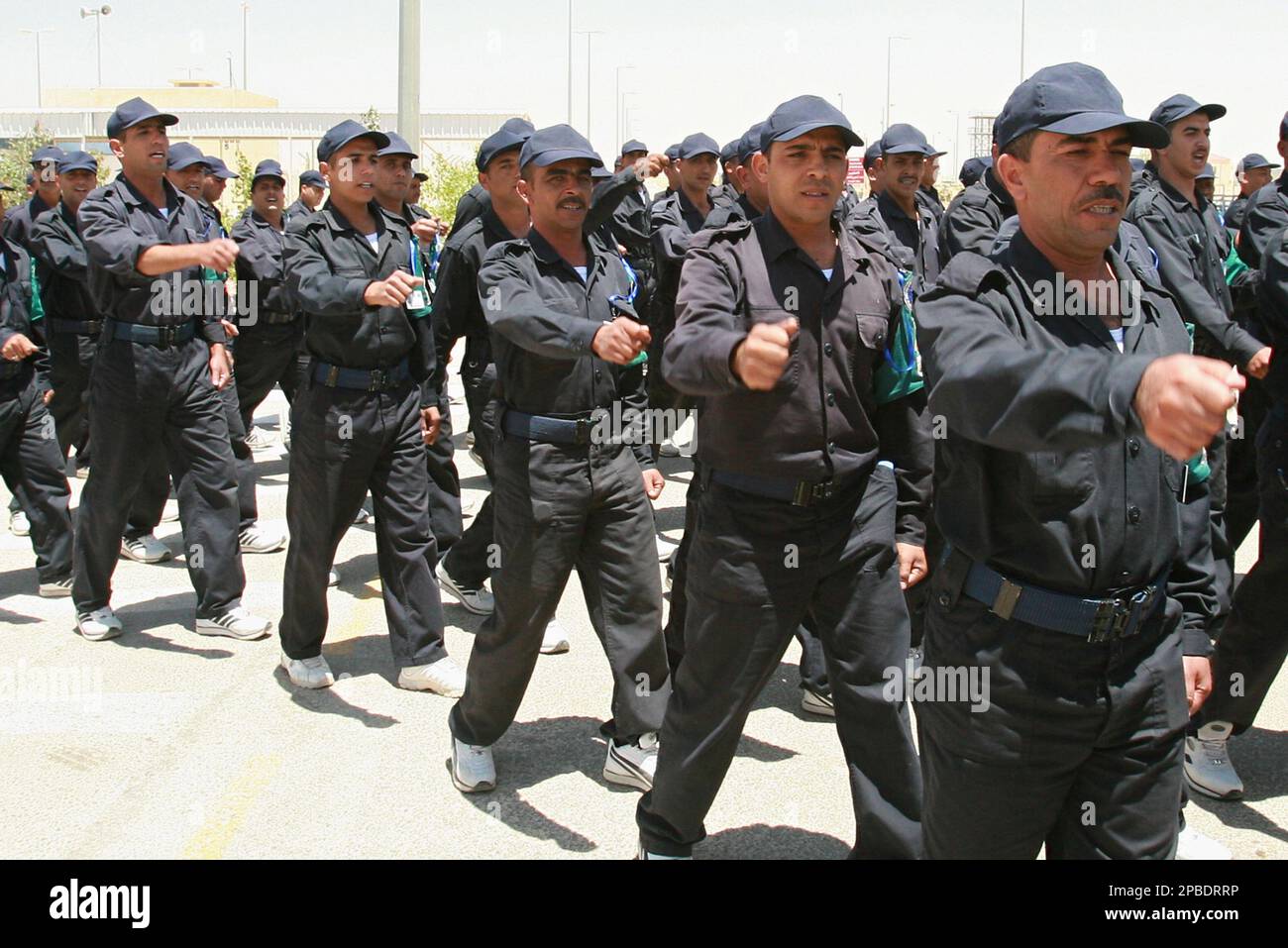 Iraqi Police cadets march during prison guard training at the Jordan ...