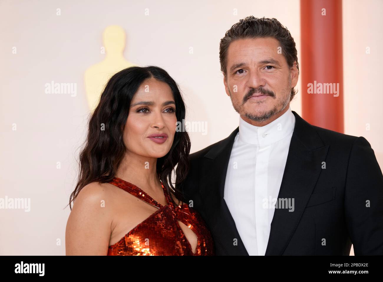 Salma Hayek, left, and Pedro Pascal arrive at the Oscars on Sunday ...