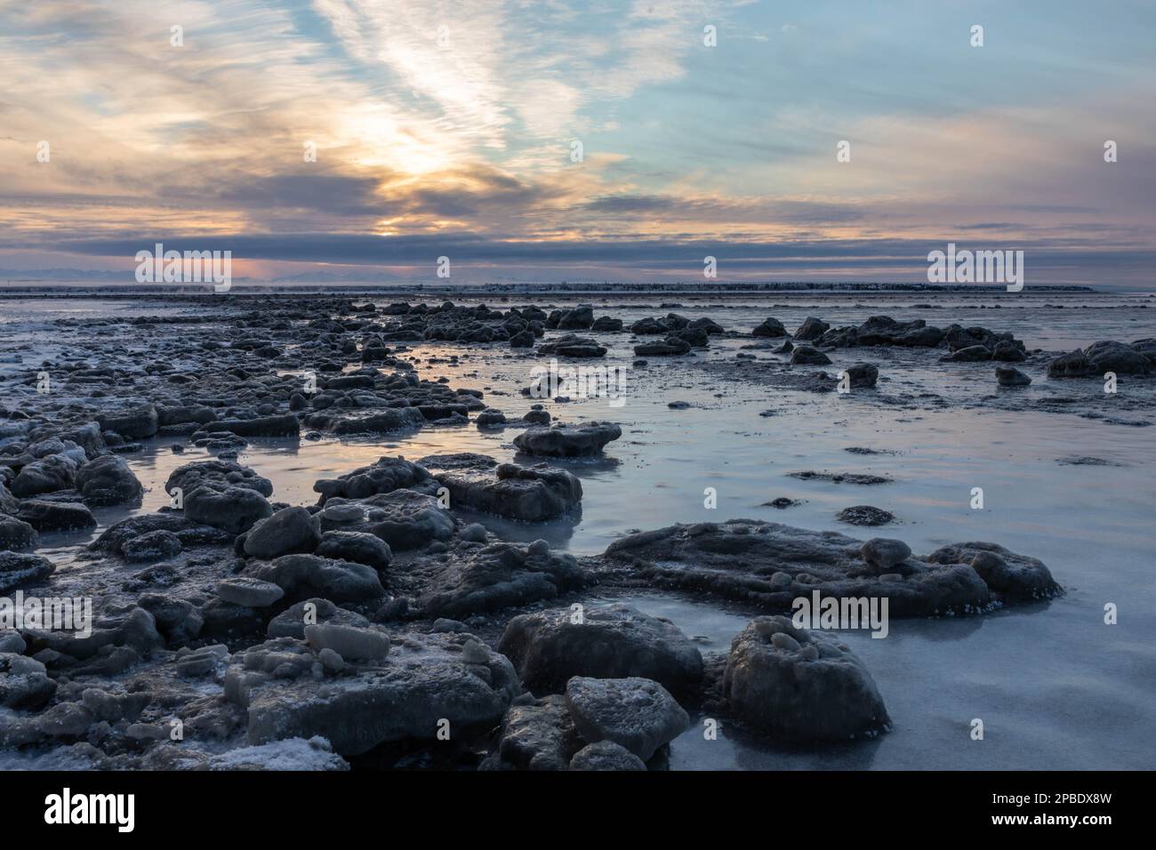 Cook Inlet in Alaska from the beautiful shoreline looking onto frozen ...