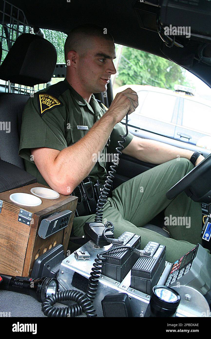 Trooper Anthony Whittington talks on his radio, Friday, June 8, 2007 ...