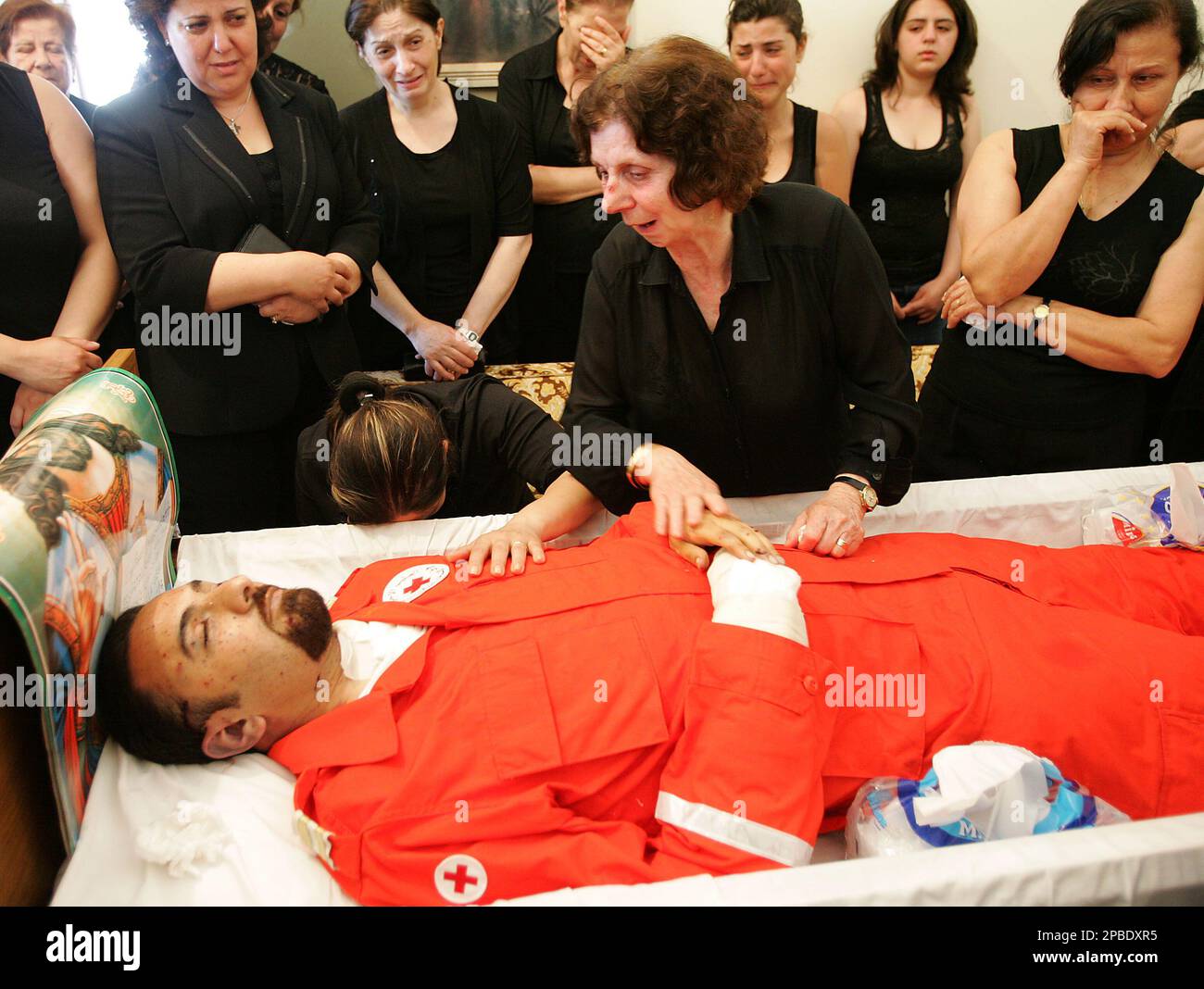 The mother, center, of the Lebanese Red Cross worker, Boulos Meaamari ...