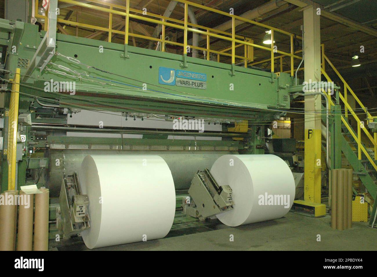 Two rolls of paper emerge from the winder on May 4, 2007, at the ...