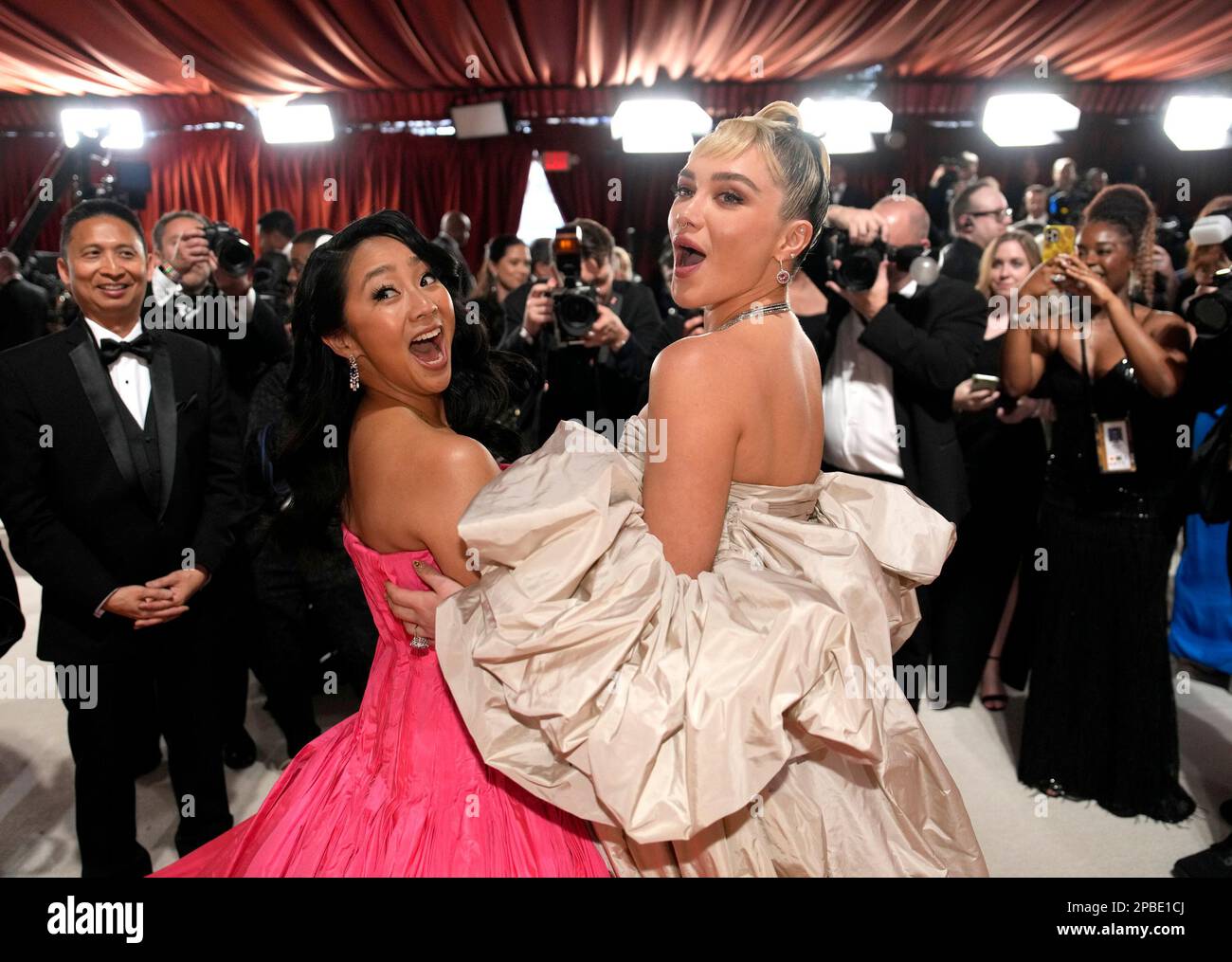Stephanie Hsu, left, and Florence Pugh arrive at the Oscars on Sunday ...