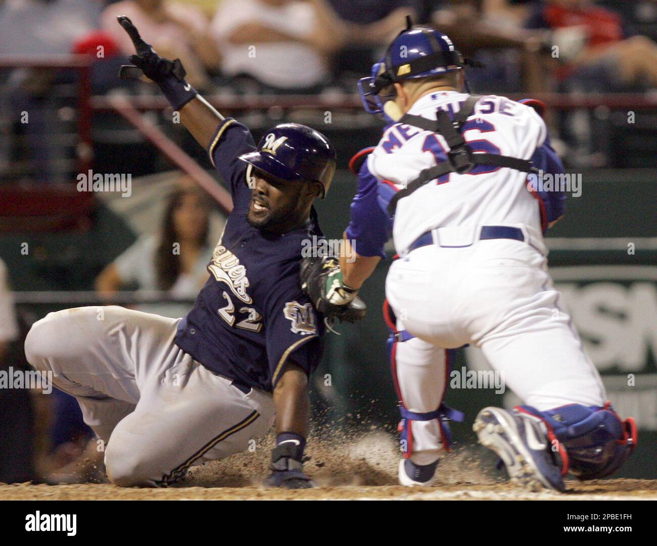 Milwaukee Brewers' Tony Gwynn (22) is tagged out at home plate by Texas ...