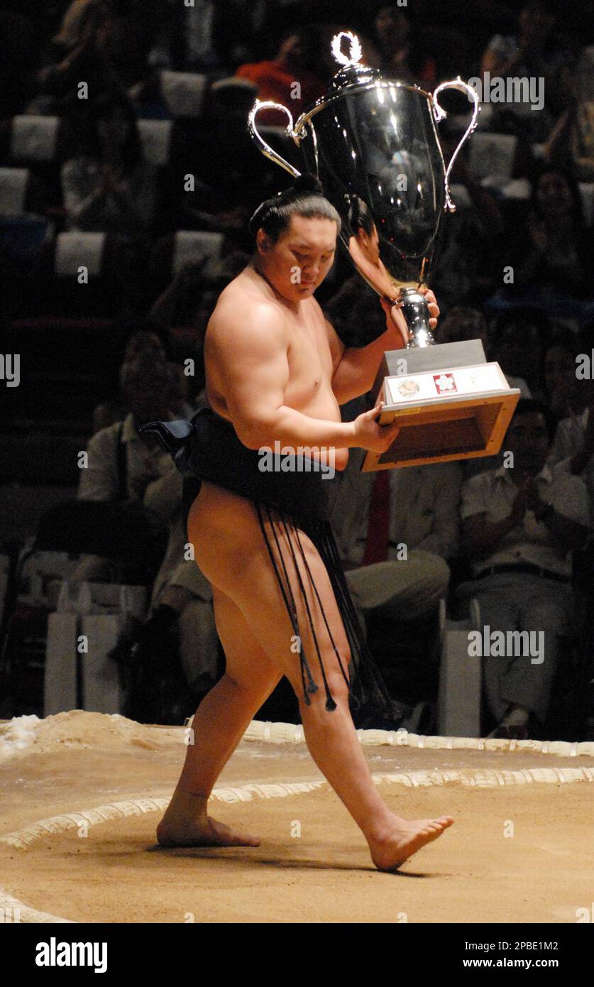 Mongolian grand champion sumo wrestler Hakuho holds the Championship ...