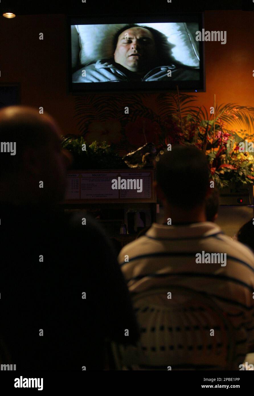 Customers watch the final episode of 'The Sopranos' at a coffee shop at ...