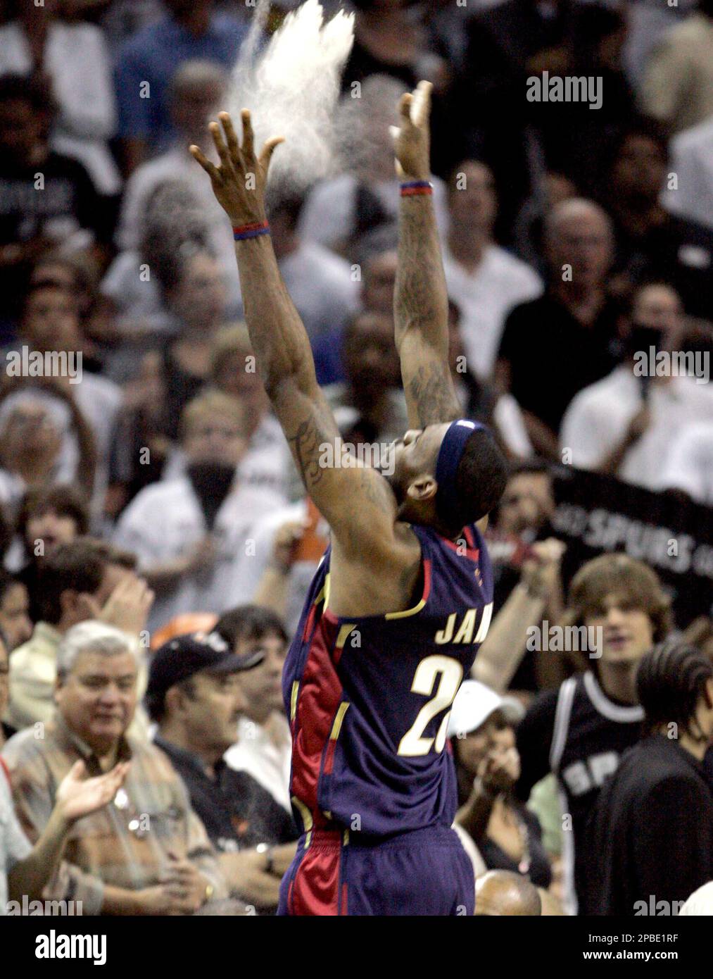 Cleveland Cavaliers forward LeBron James applies rosin to his hands ...