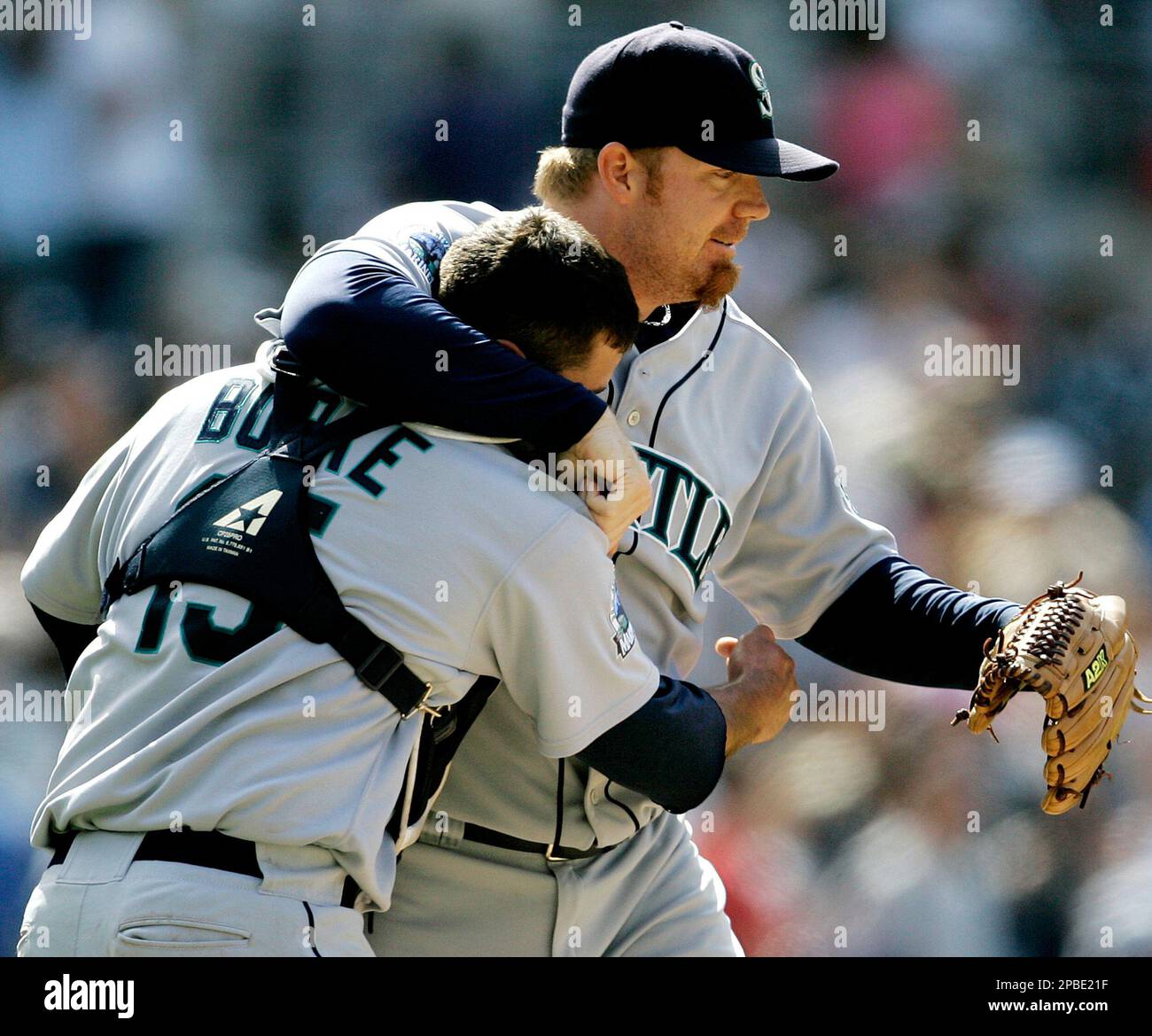 Seattle Mariners closer J.J. Putz, right, puts a headlock hug on ...