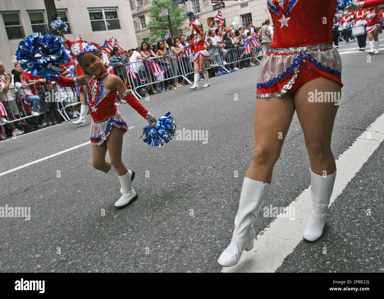 Miladi Cordero, 5, marches up Fifth Ave. during the Puerto Rican Day ...