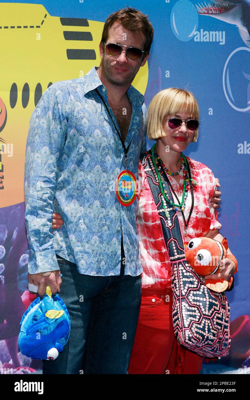 Thomas Jane, left, and Patricia Arquette arrive at the Finding Nemo ...