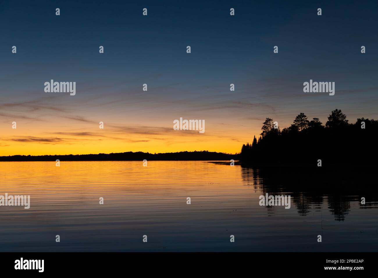 Fading sunset glow at dusk over northern lake scene for magazine ...