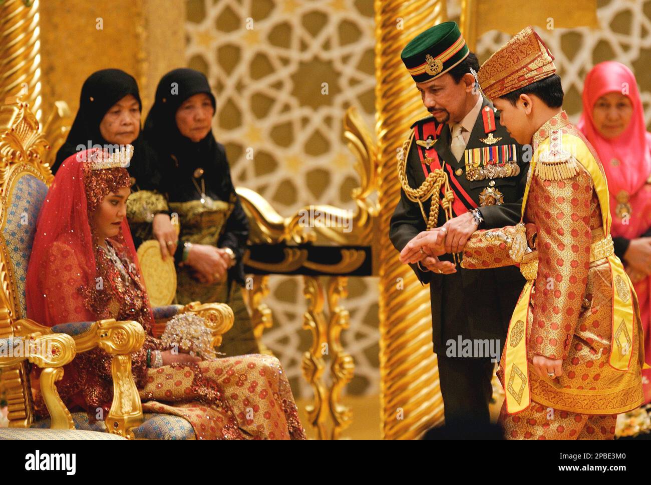 Brunei Sultan Hassanal Bolkiah, second right, leads bridegroom Khairul ...