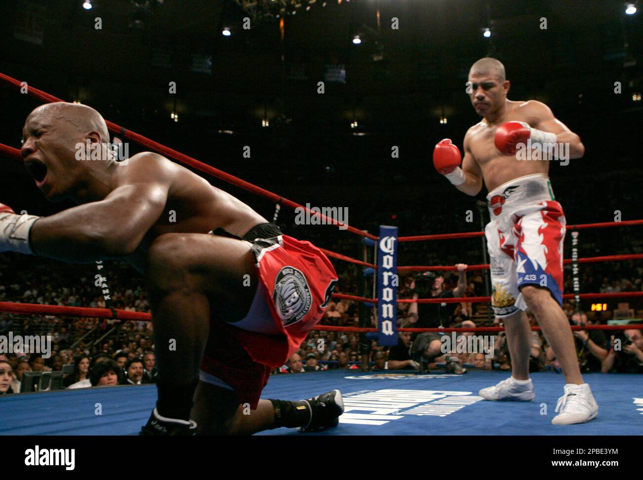 Zab Judah, left, reacts to a low blow during the third round of boxing ...