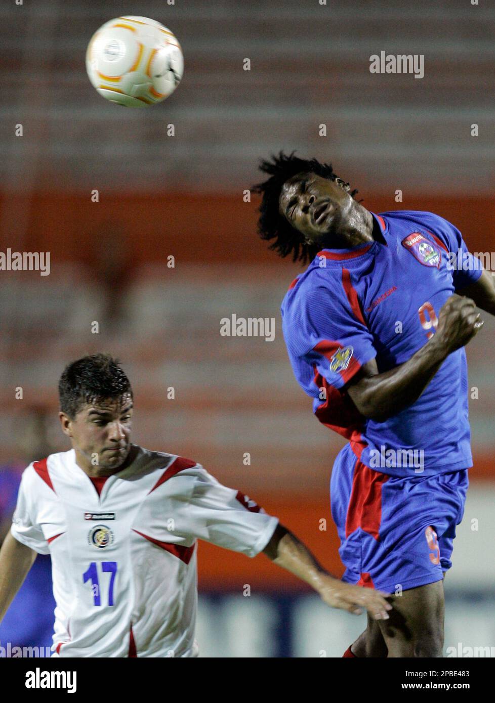 Haiti's Cadet Eliphene, right, heads the ball as Costa Rica's Gabriel ...