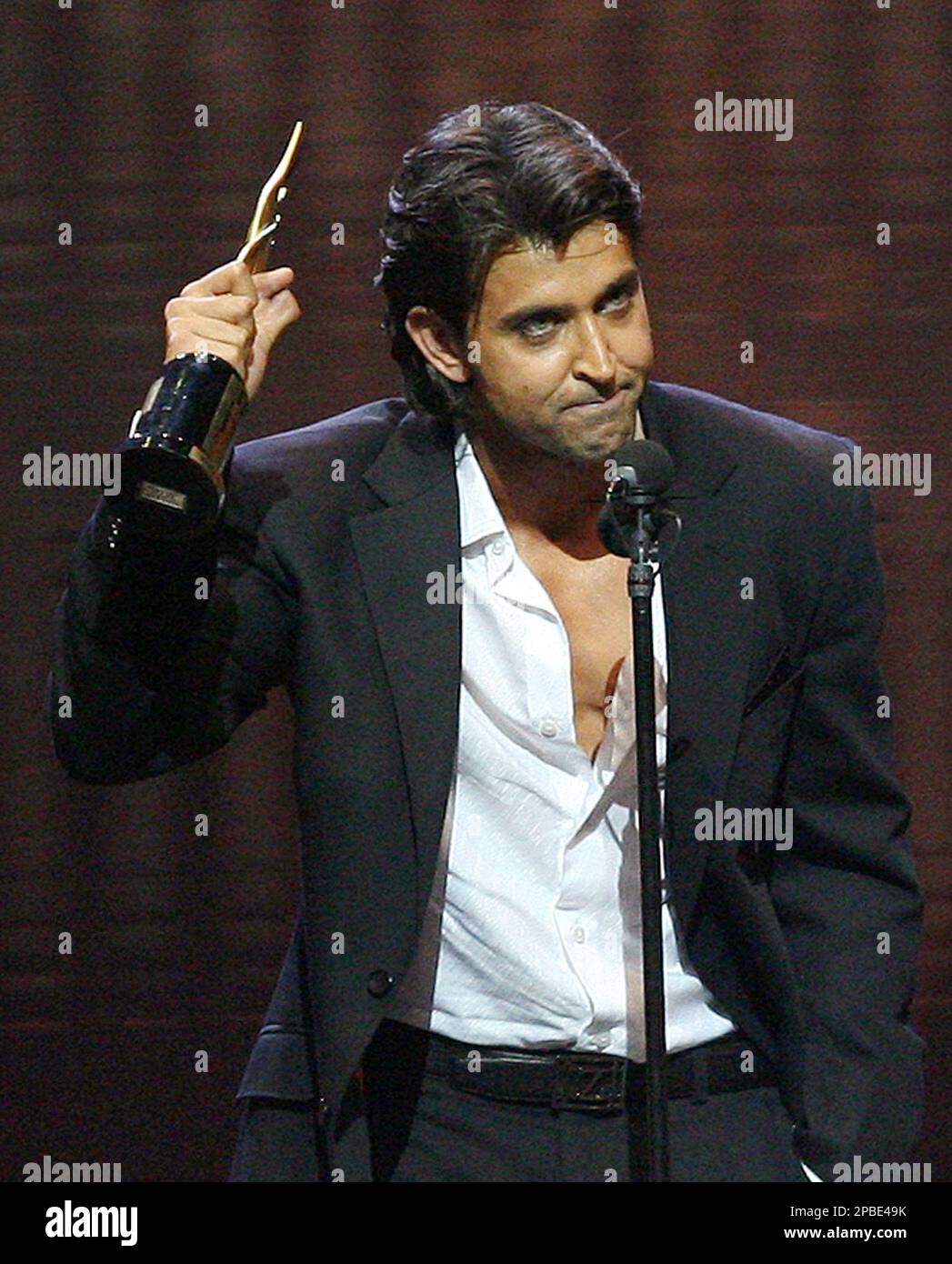 Bollywood star Hrithik Roshan celebrates winning the award for Best ...