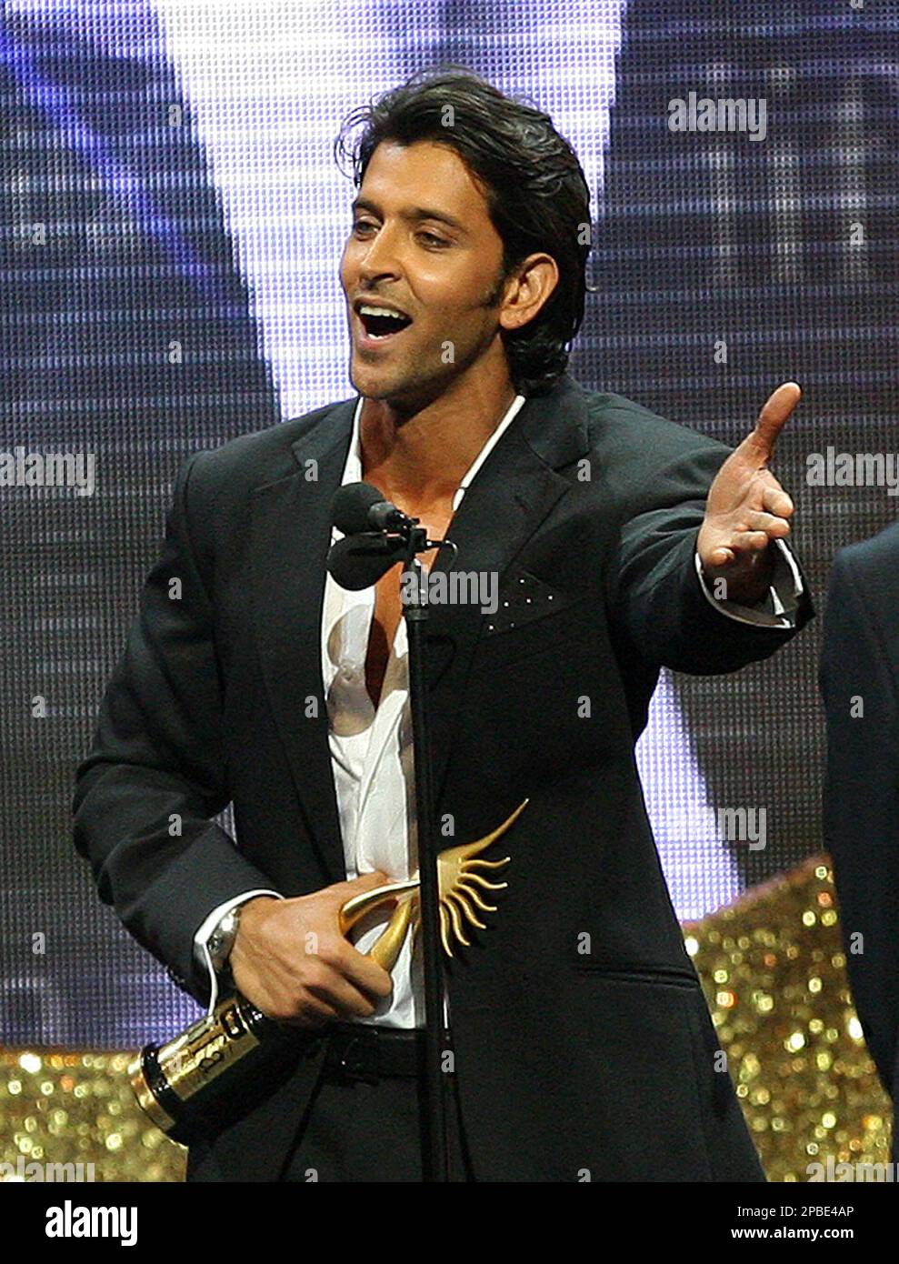 Bollywood star Hrithik Roshan speaks on stage after receiving the Most ...
