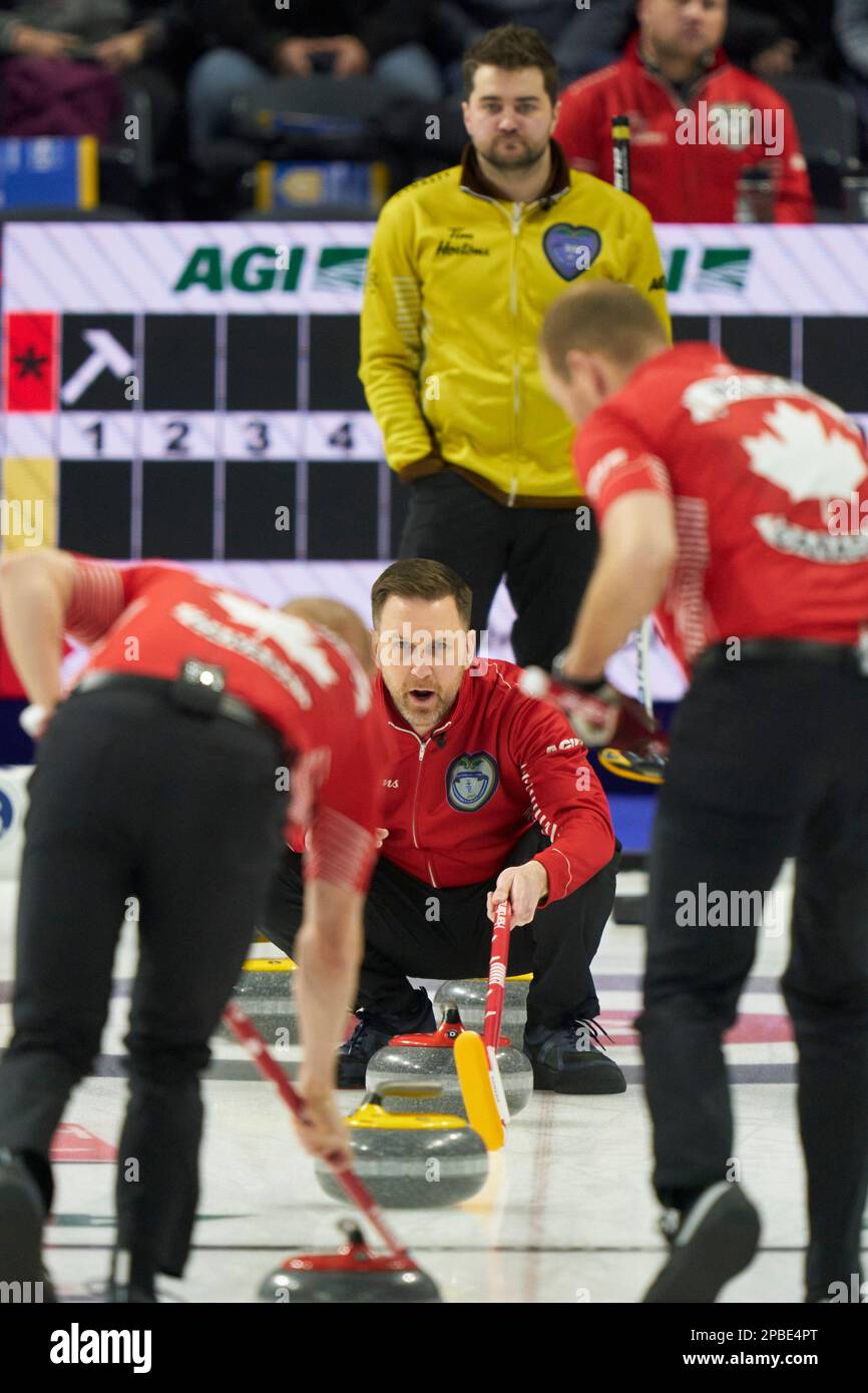 Team Canada skip Brad Gushue calls to his sweepers during the Tim ...