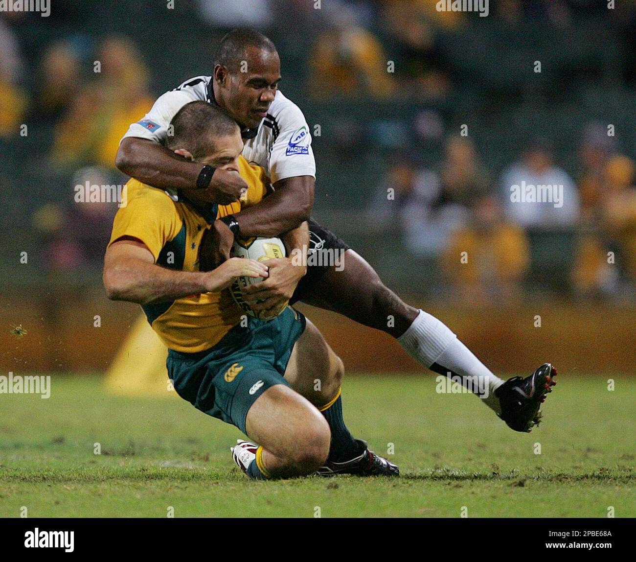 Fiji's Jack Prasad tackles Scott Staniforth during his country's Rugby ...