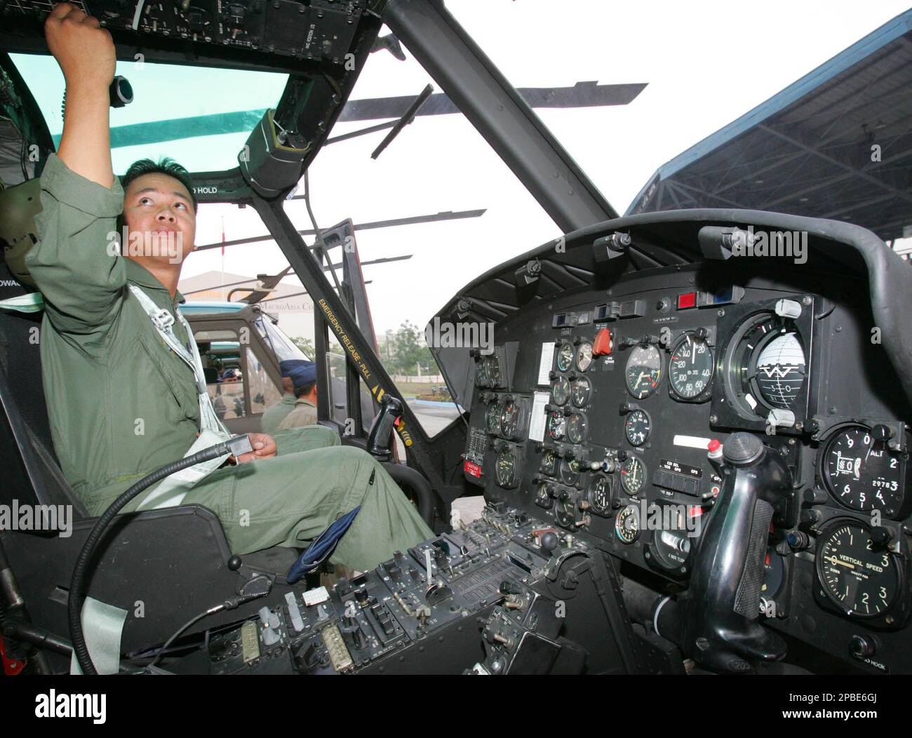 A Philippine Air Force helicopter pilot checks one of the newly ...