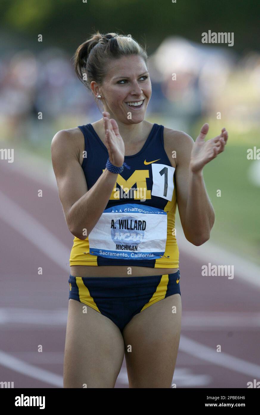 Michigan's Anna Willard celebrates her win in the 3,000 meter ...