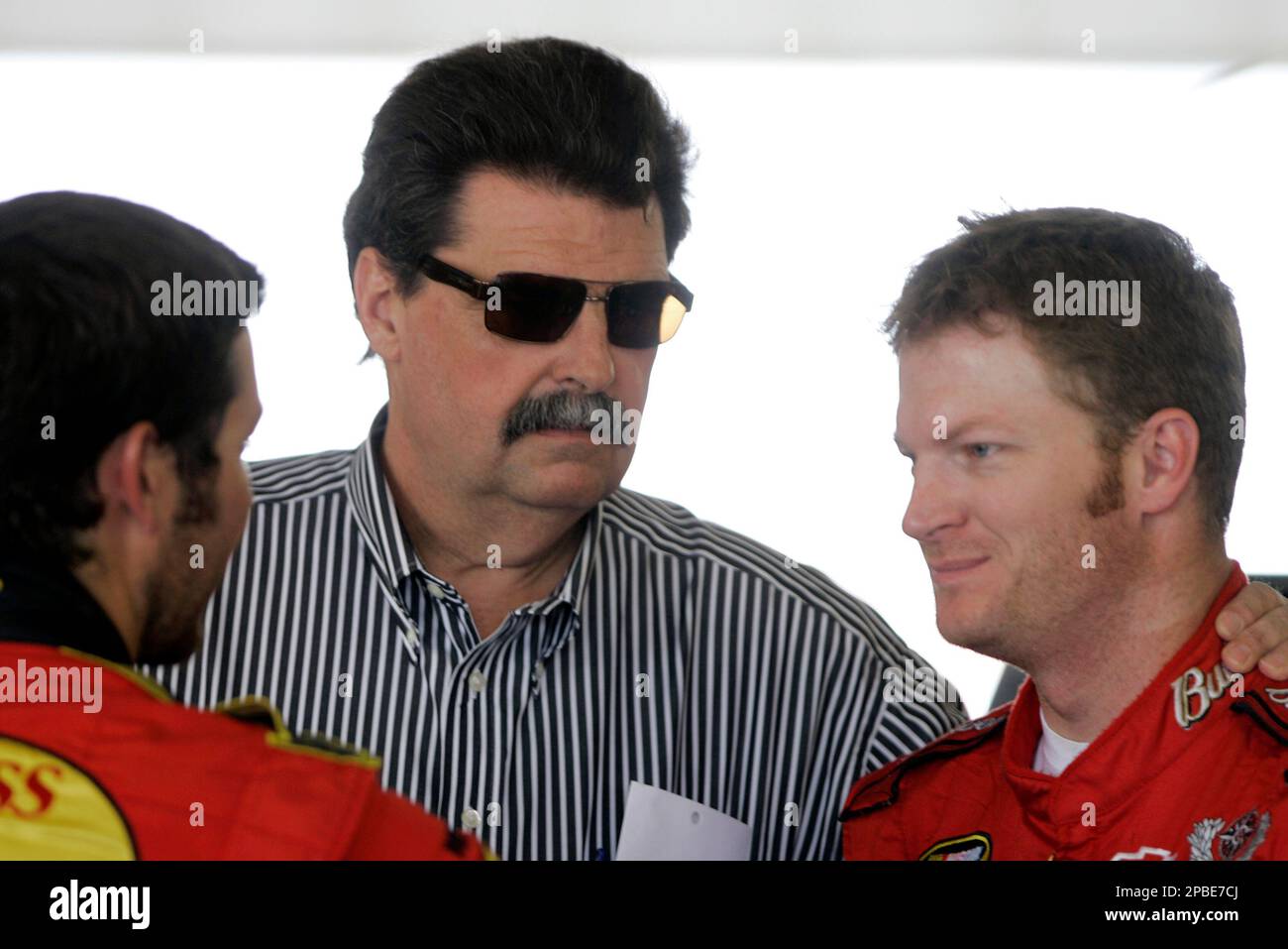 Mike Helton, president of NASCAR, center, Martin Truex Jr., left, and ...