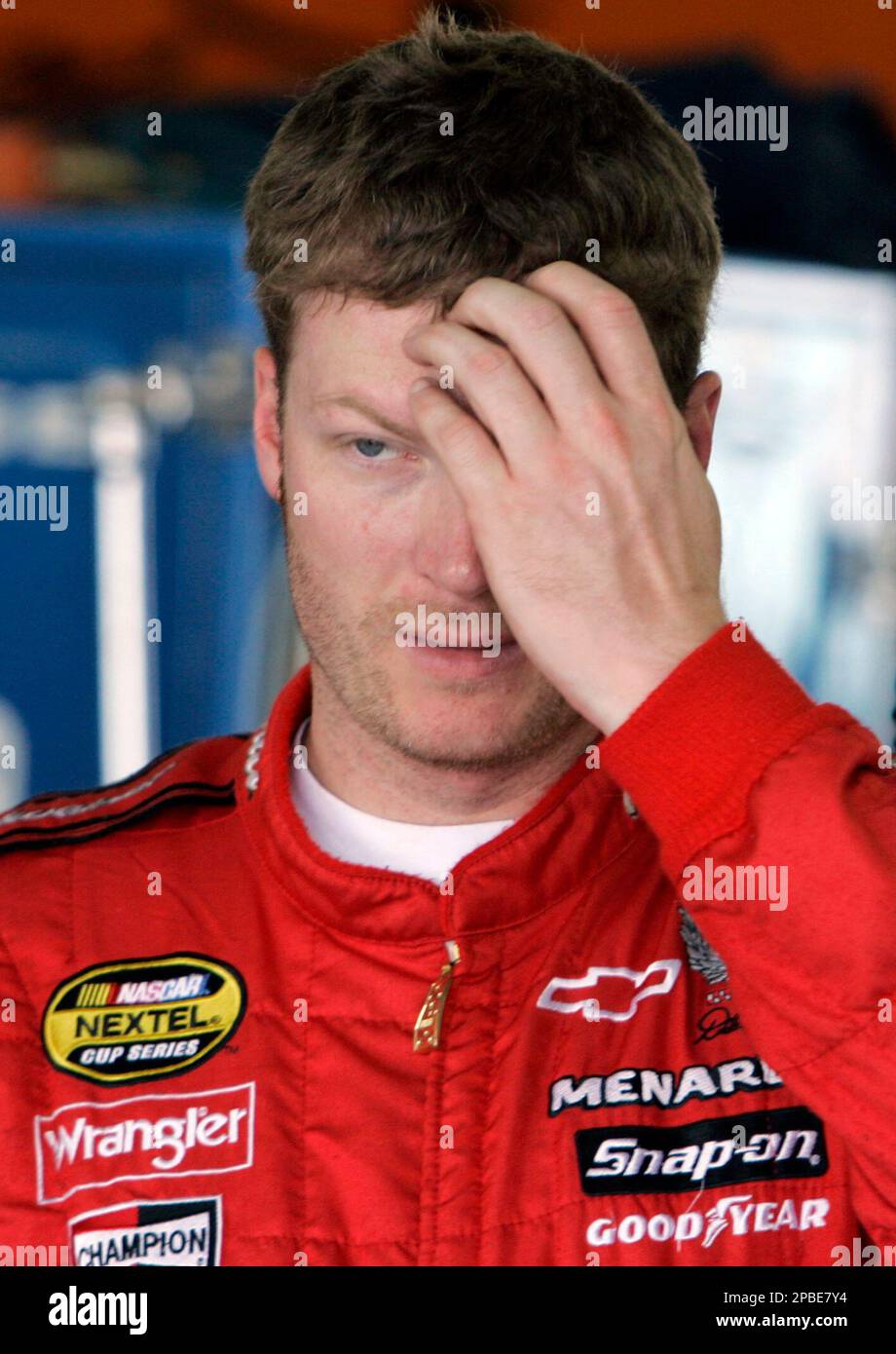 NASCAR driver Dale Earnhardt Jr. stand in the garage during a practice ...