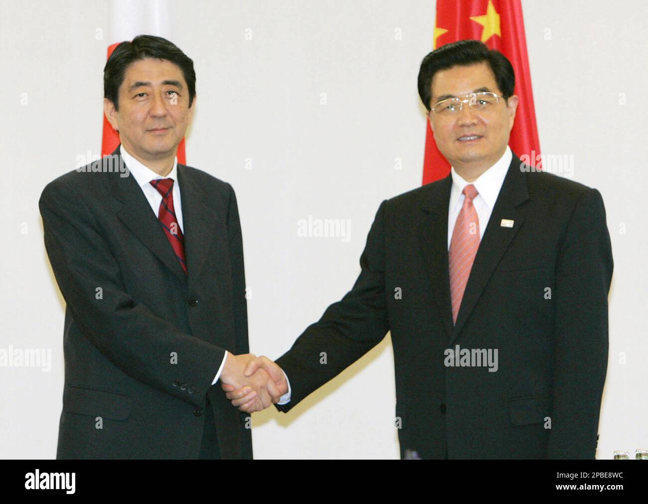 Japanese Prime Minister Shinzo Abe, left, and Chinese President Hu ...