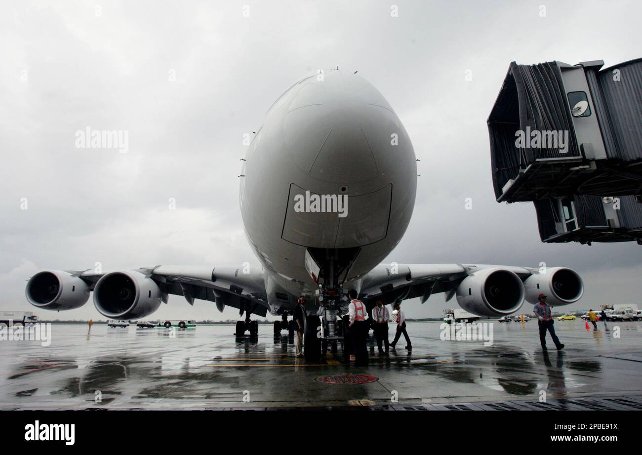 Ground crew receive an Airbus super jumbo A380 passenger jet at Taiwan ...
