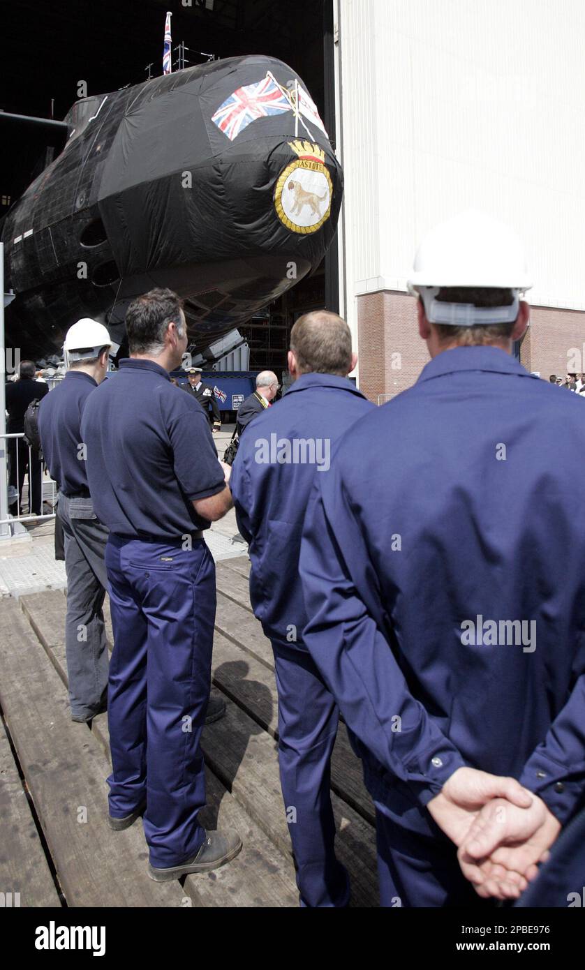 Production staff look on as the first Astute class nuclear submarine is ...