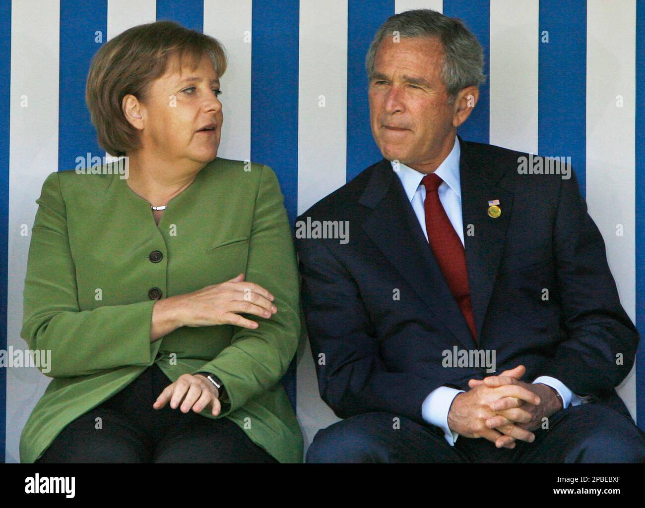 German Chancellor Angela Merkel and U.S. President George Bush speak to ...