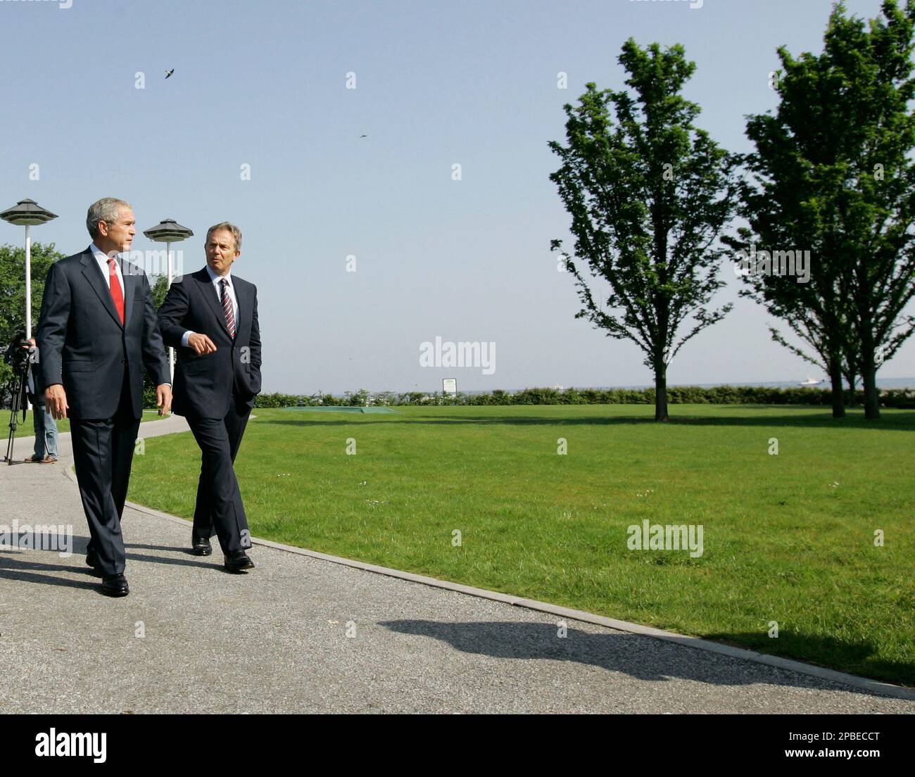 U.S. President Bush, left, walks with British Prime Minister Tony Blair ...