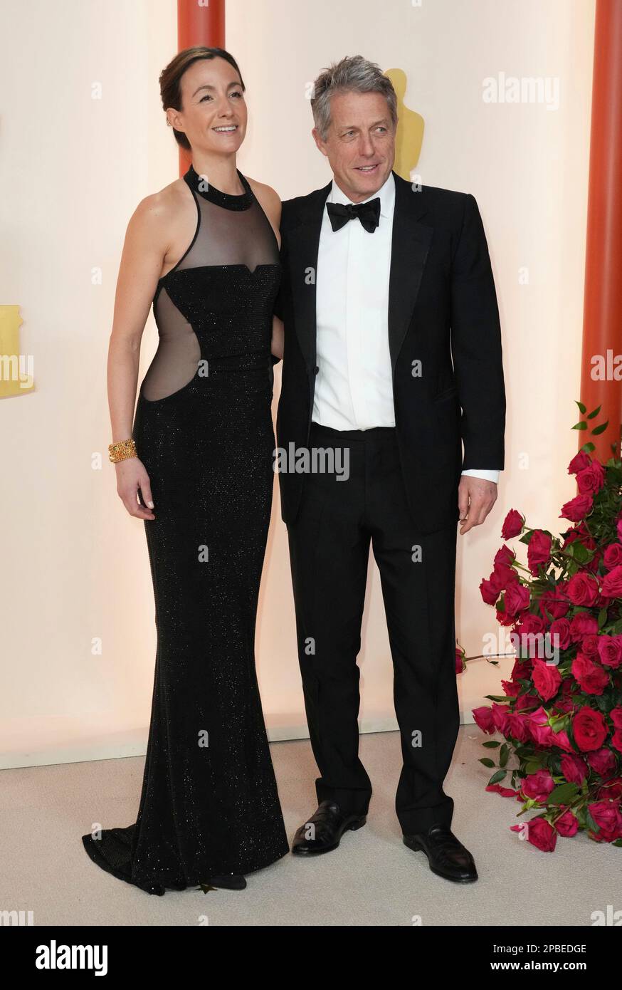 Anna Elisabet Eberstein, left, and Hugh Grant arrive at the Oscars on ...