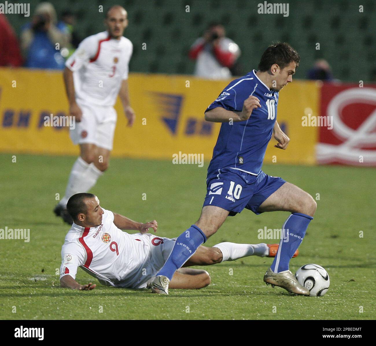 Bosnia's Zvjezdan Misimovic, right, runs with the ball as Malta's ...