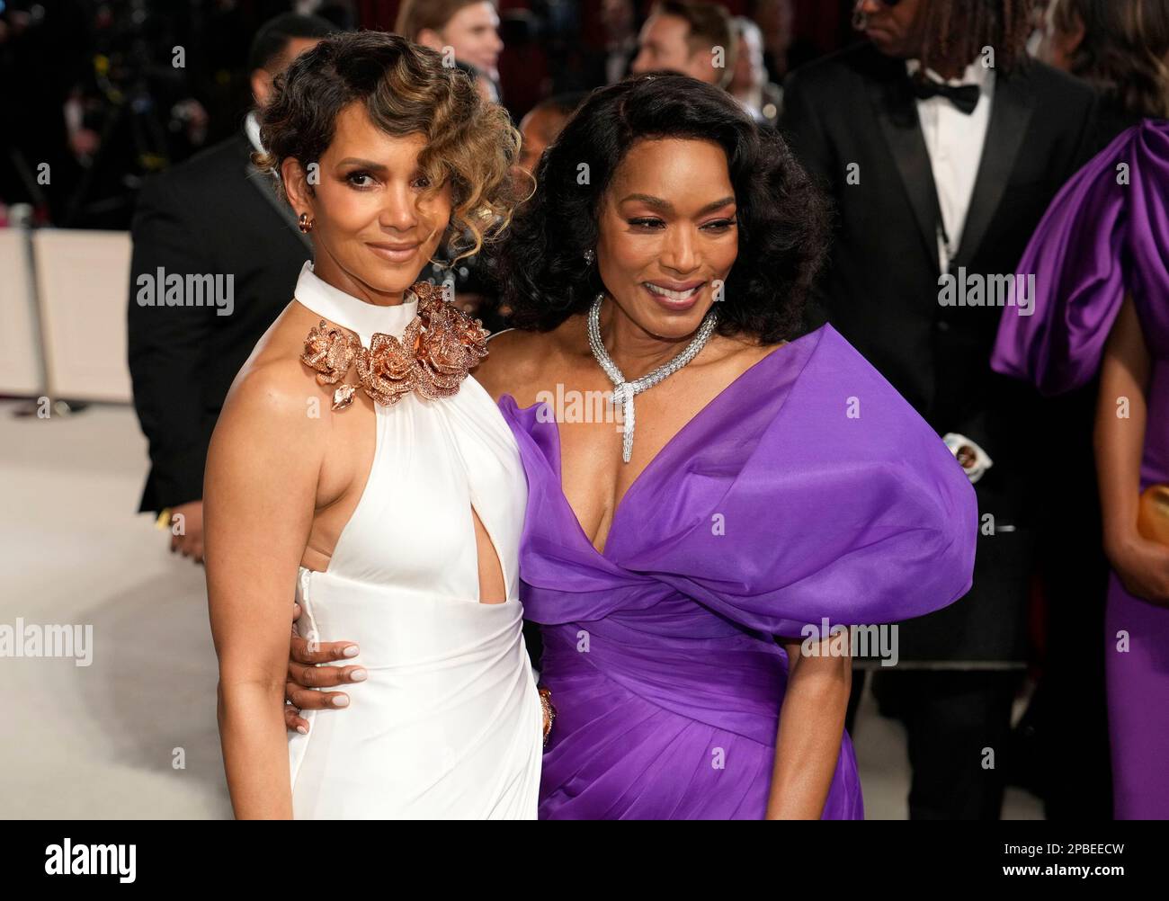Halle Berry, left, and Angela Bassett arrive at the Oscars on Sunday ...