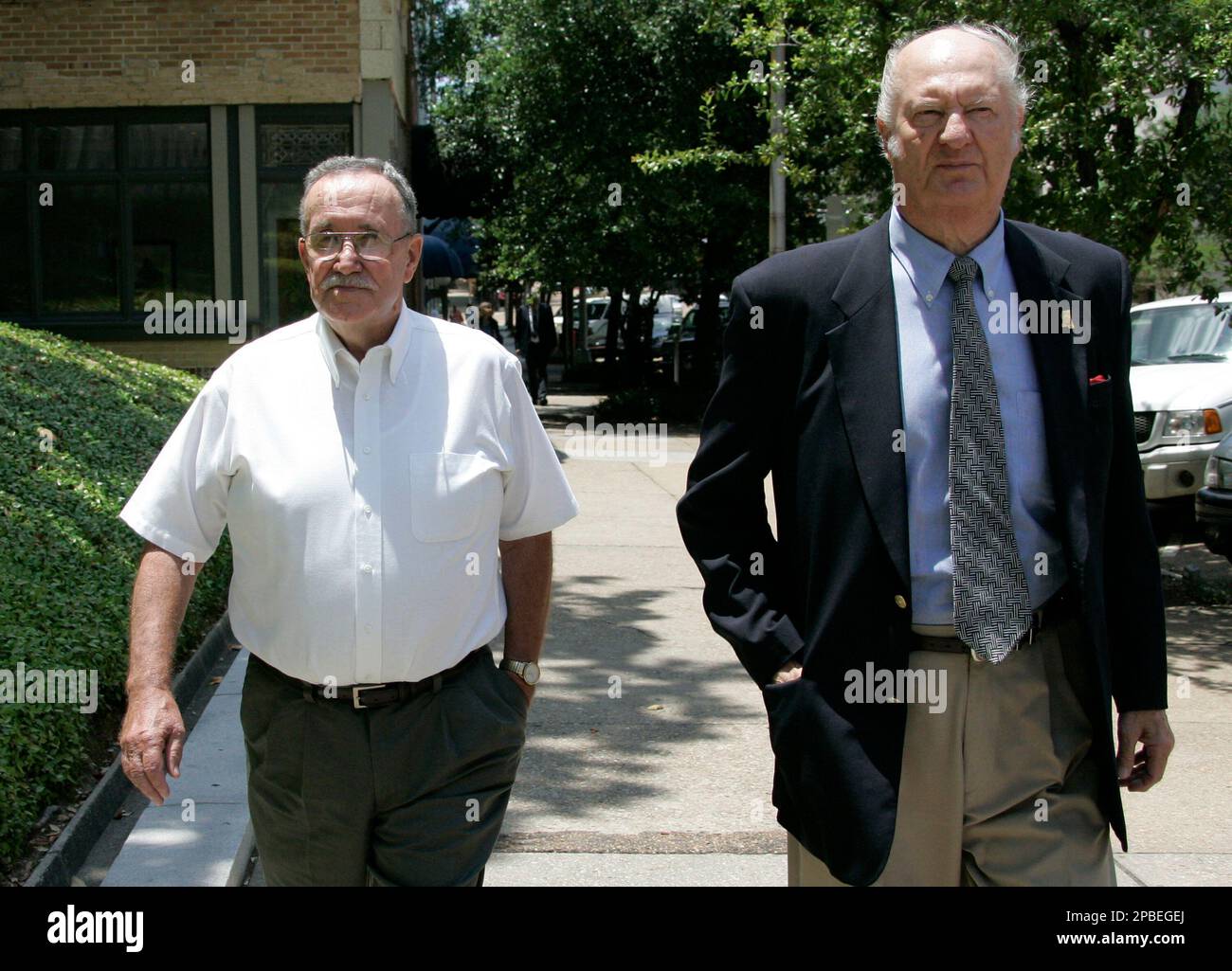 Reputed Klansman Charles Marcus Edwards, left, is escorted to the ...