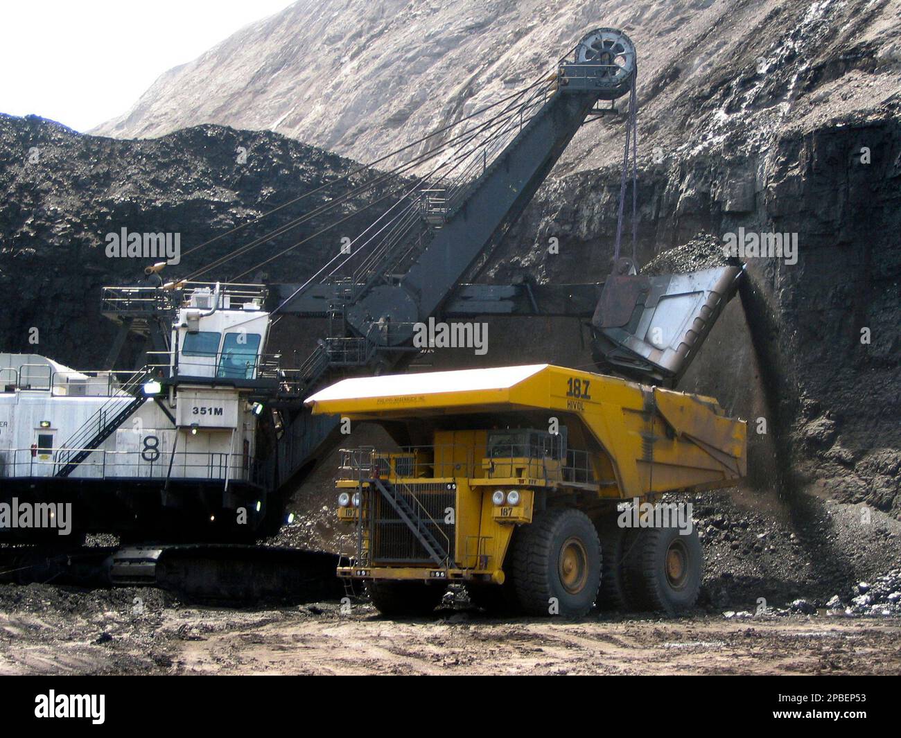 A shovel prepares to dump another load of coal into a 320-ton truck at ...
