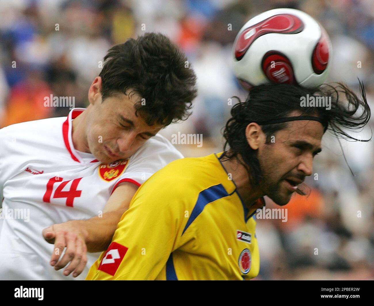 Colombia's Mario Yepes, right, battles for the ball against Montenegro ...
