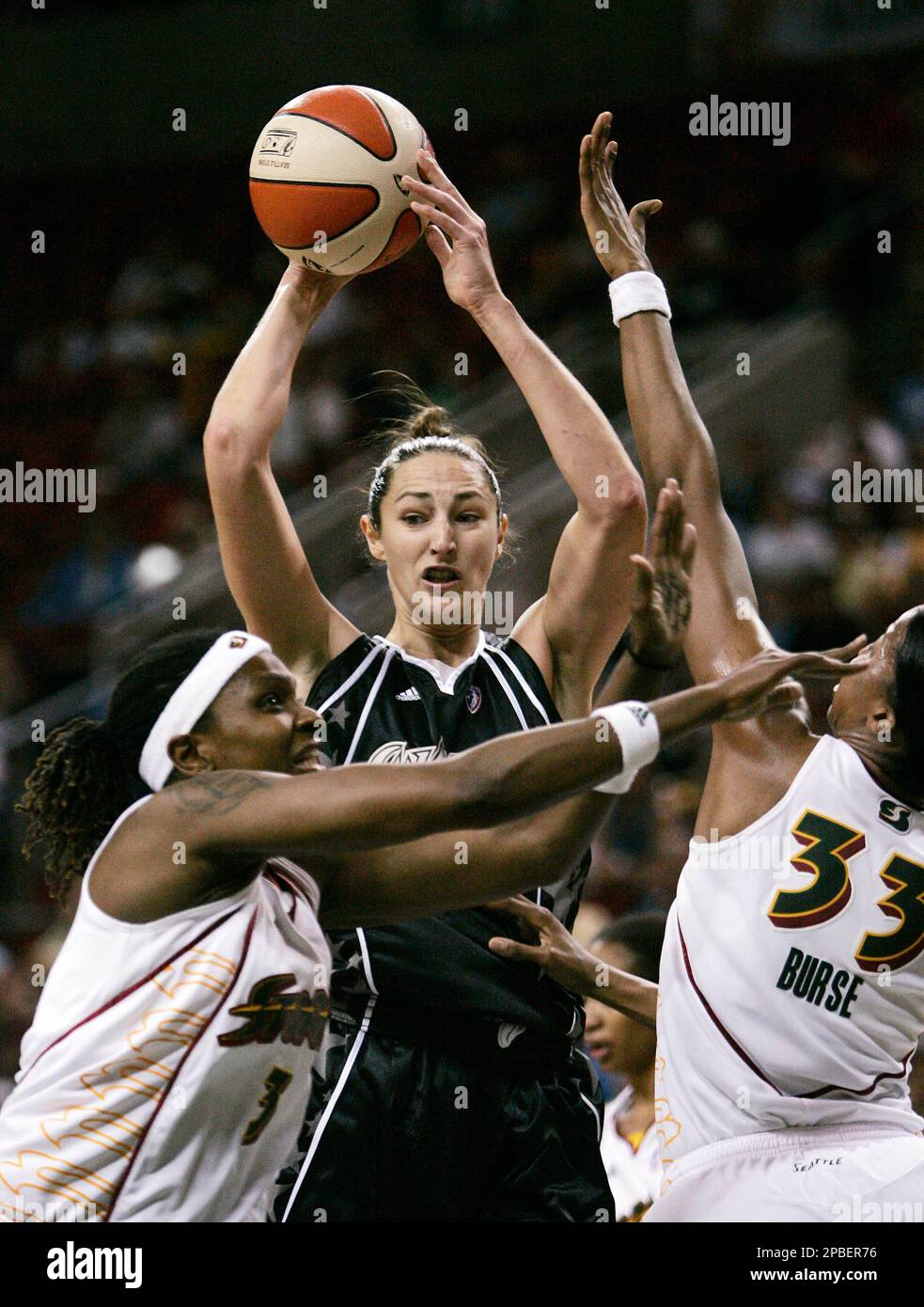 San Antonio Silver Stars' Ruth Riley, center, looks for room to pass ...