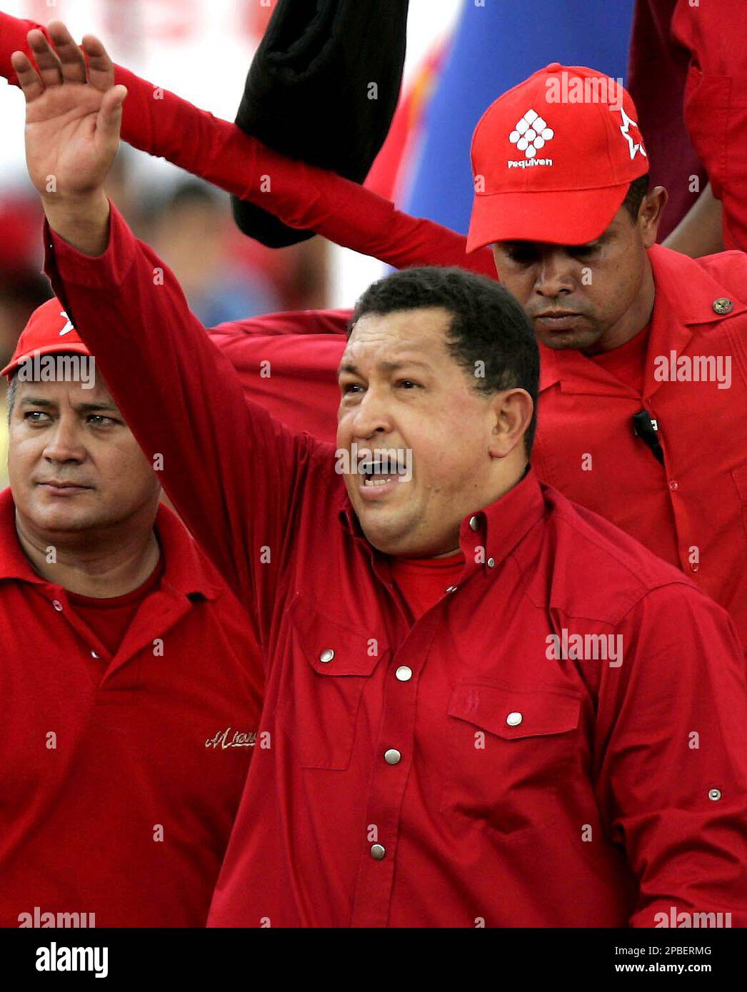 Venezuela's President Hugo Chavez waves to supporters during a rally to ...