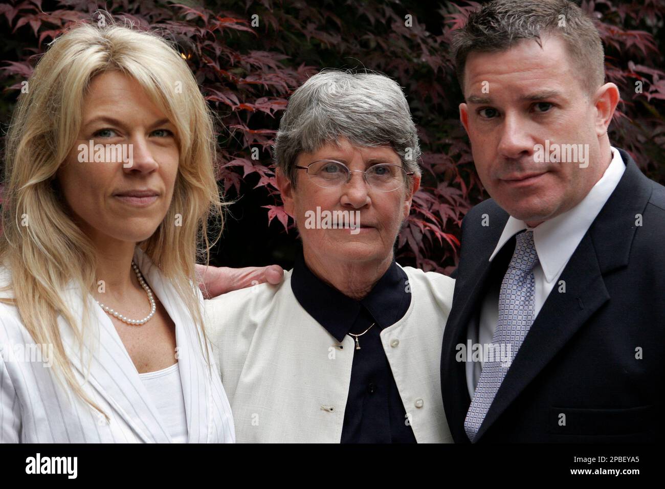 Teresa Getchell, center, with her daughter, Karen, and son, Greg, talks ...